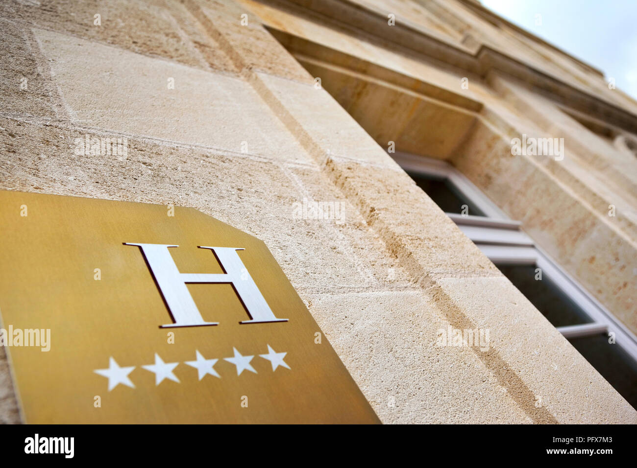 Golden sign on the facade of a luxurious hotel Stock Photo - Alamy