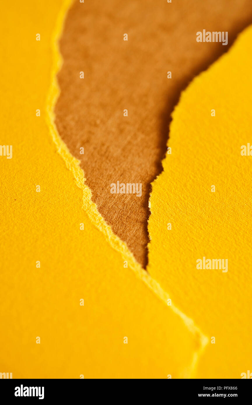 Ripped paper yellow hi-res stock photography and images - Alamy