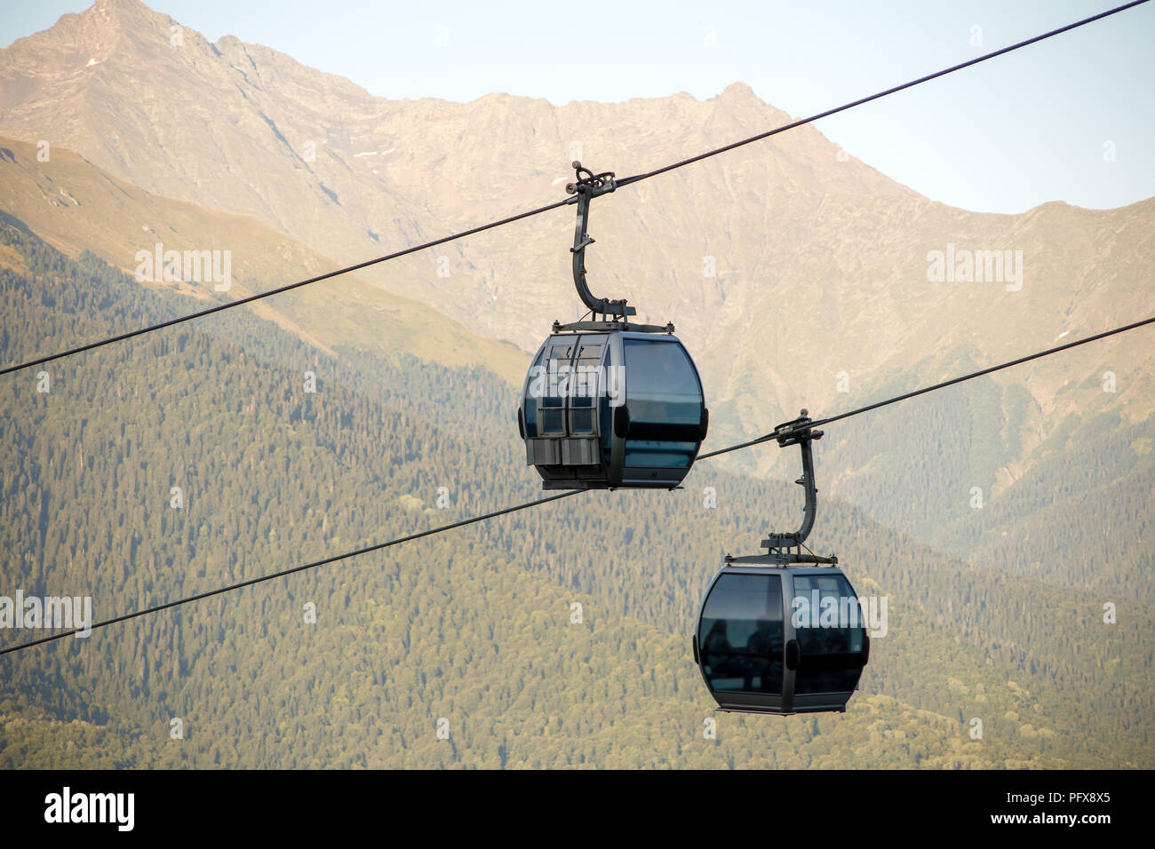 Close-up photo of two funiculars among mountain hills Stock Photo - Alamy