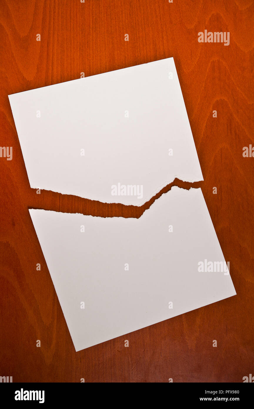 white paper that has been ripped in half Stock Photo - Alamy