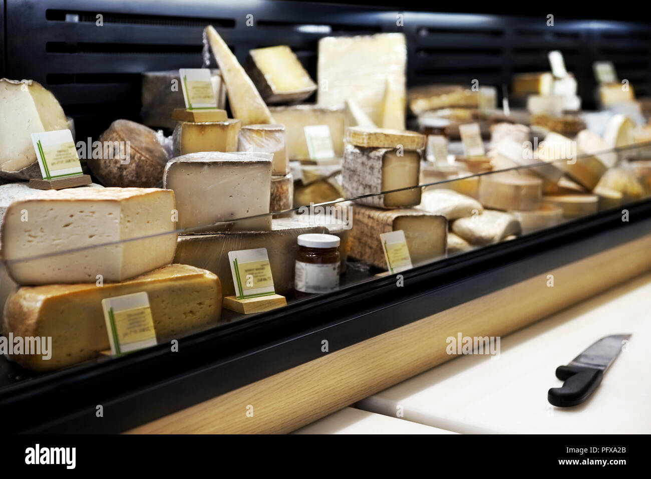 Cheese stall inside a French dairy store Stock Photo - Alamy