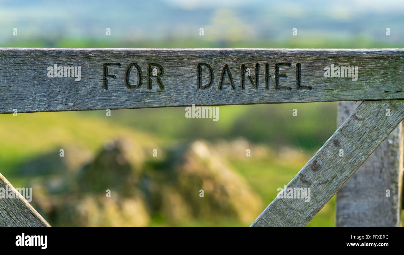 A gate with "For Daniel" engraved, seen between Church Stretton and ...