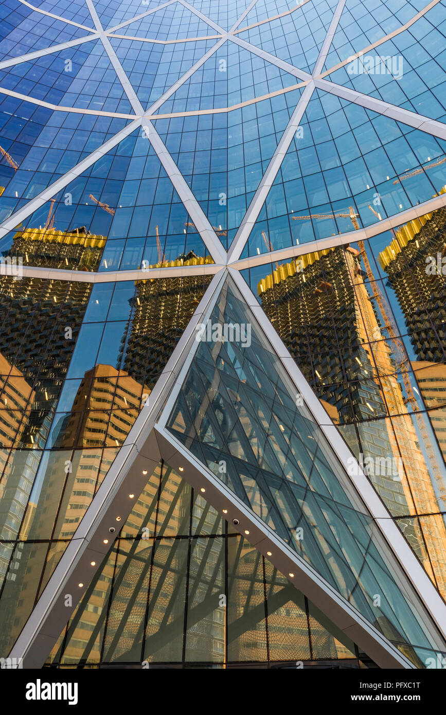 New Telus Sky building construction reflected in Bow Tower glass ...