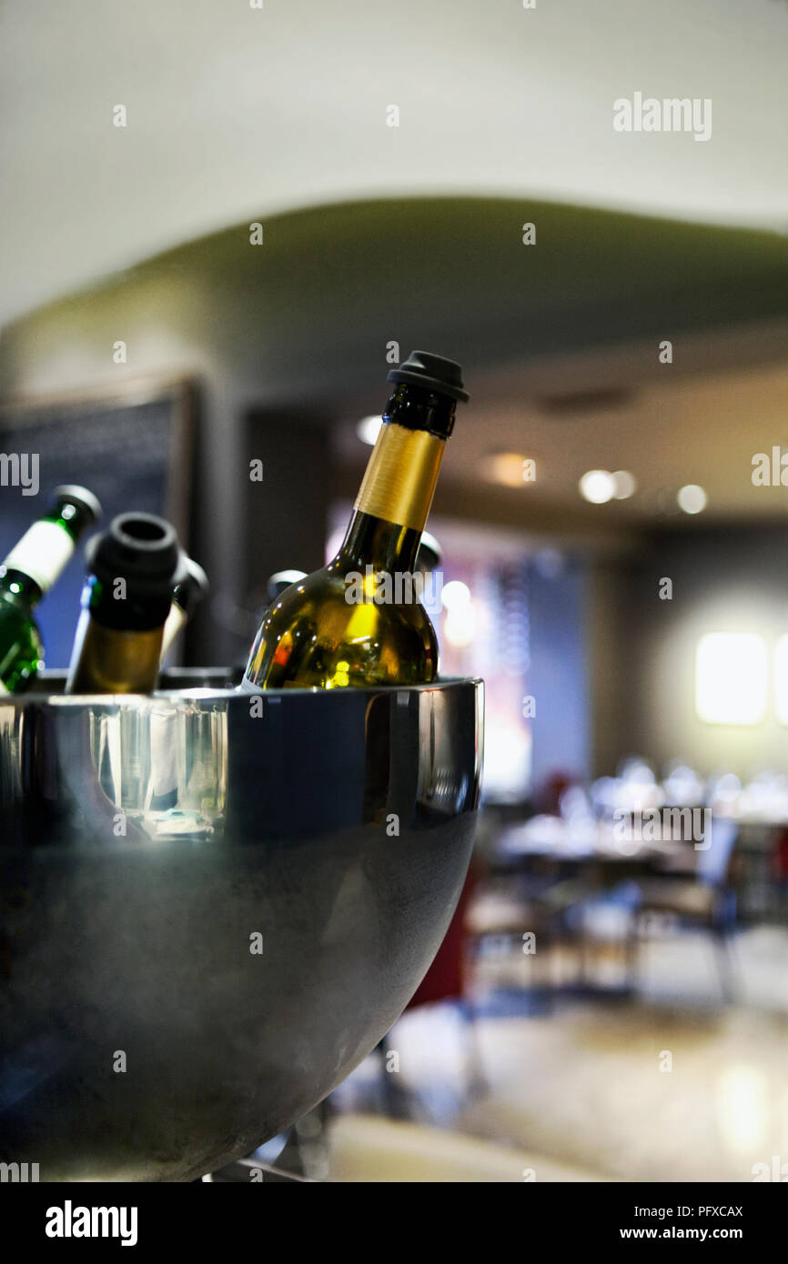 Wine bottles in a bucket in a French pub Stock Photo - Alamy