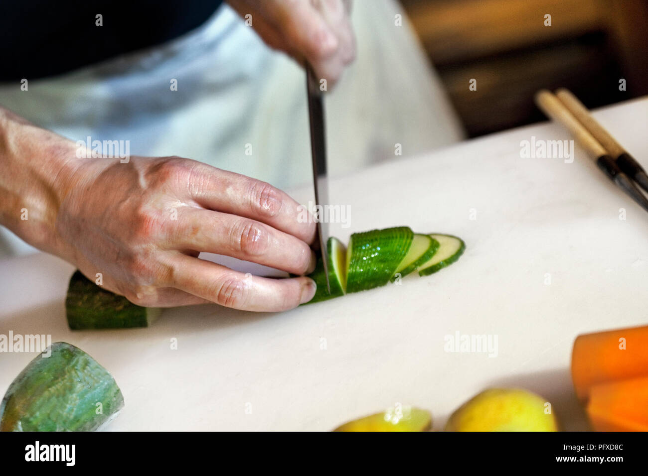 Cutting vegetable on the table of a restaurant kitchen Stock Photo - Alamy