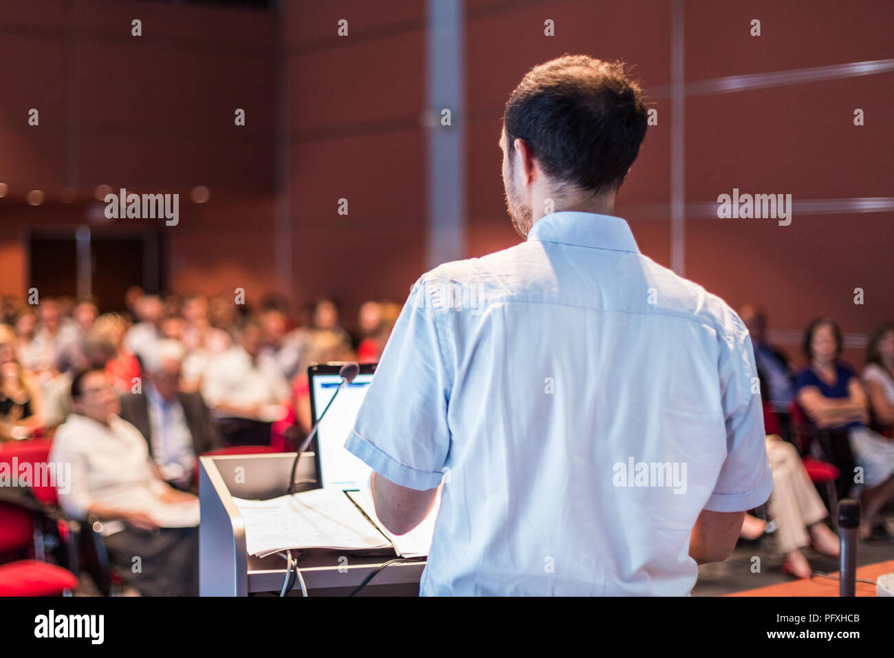 Public speaker giving talk at Business Event Stock Photo - Alamy