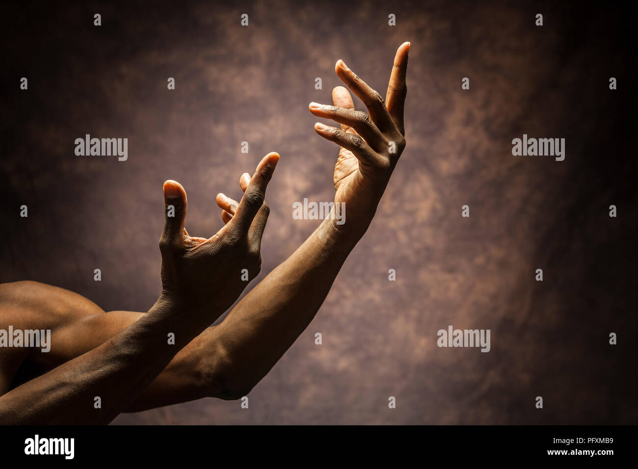 A pair of African American / black hands and arms in various positions ...