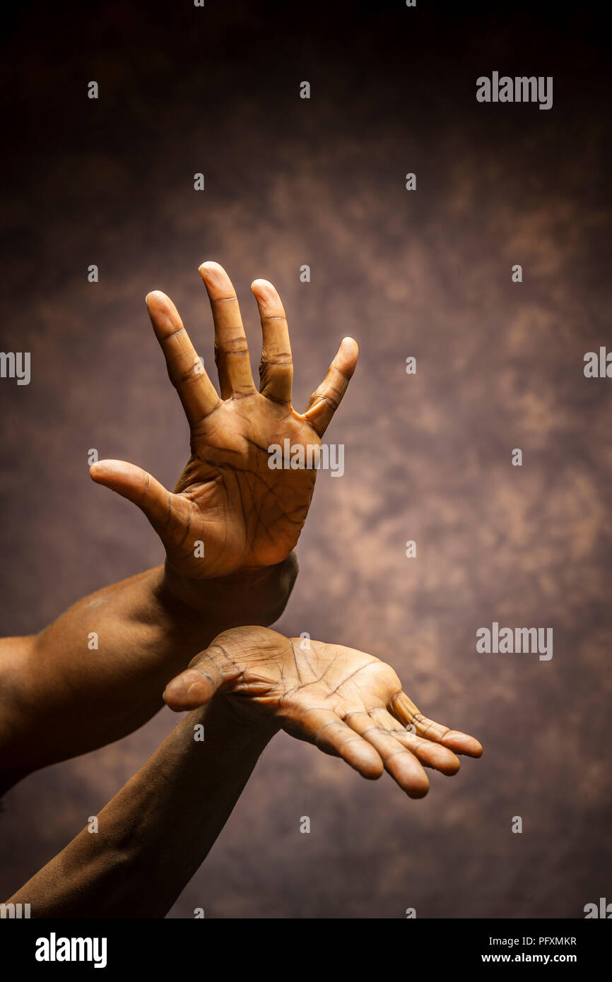 A pair of African American / black hands and arms in various positions ...