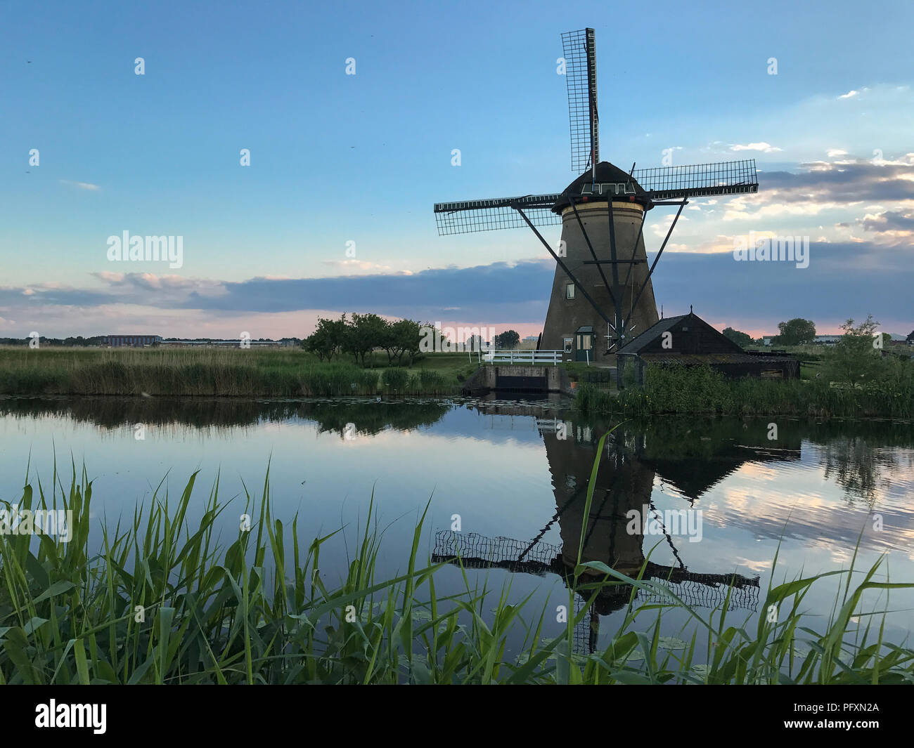 Beautiful dutch windmill landscape at the famous Kinderdijk canals ...
