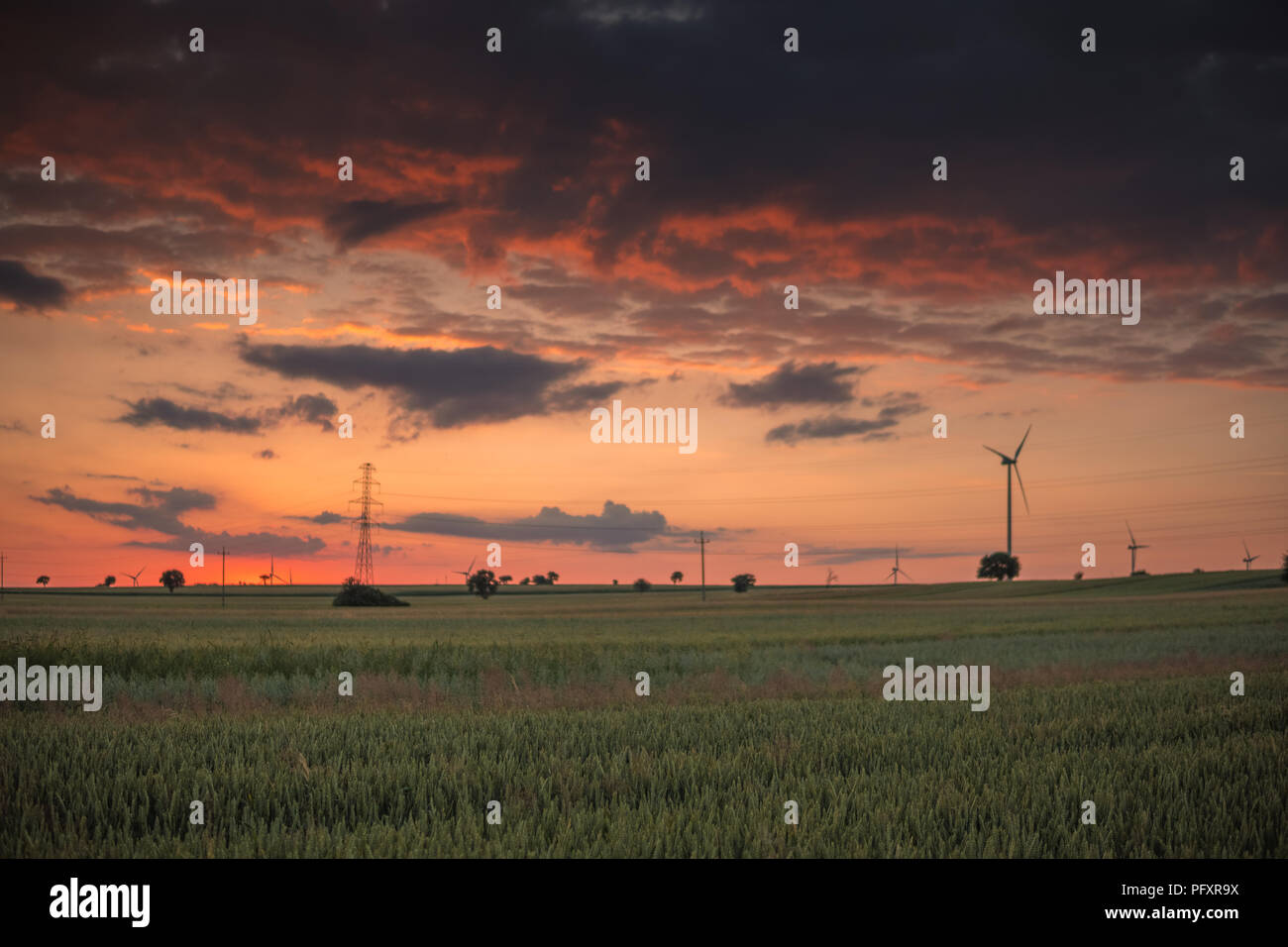 red sky and dark clouds after sunset over fields Stock Photo - Alamy