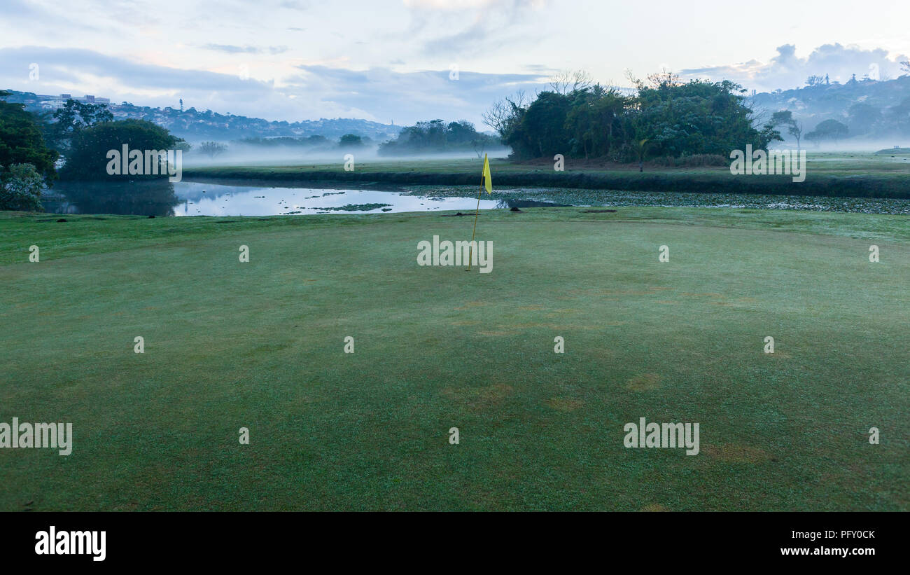Golf Course dawn water holes mist trees valley landscape Stock Photo ...