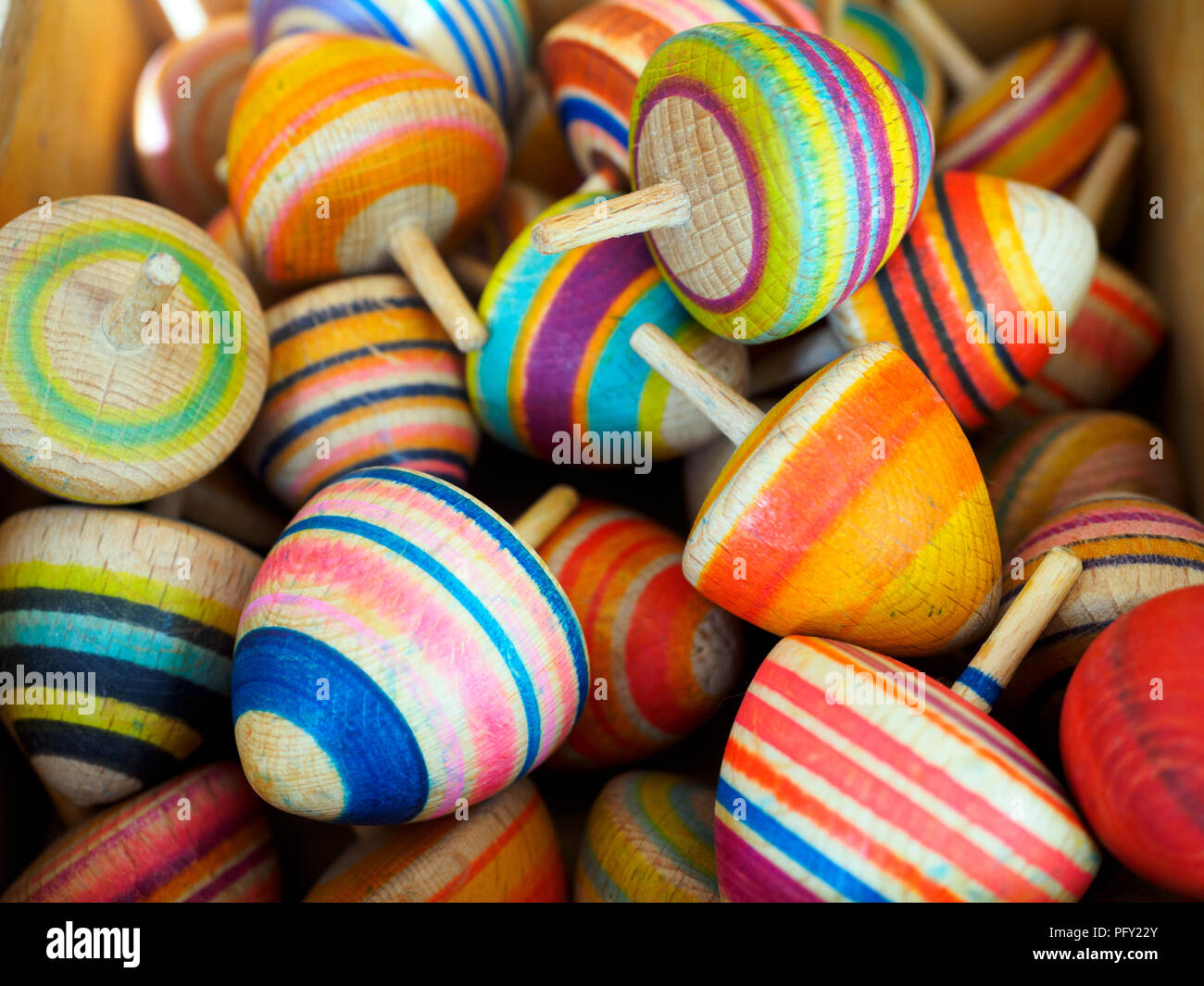 Coloured wooden spinning tops - Bruges, Belgium Stock Photo - Alamy
