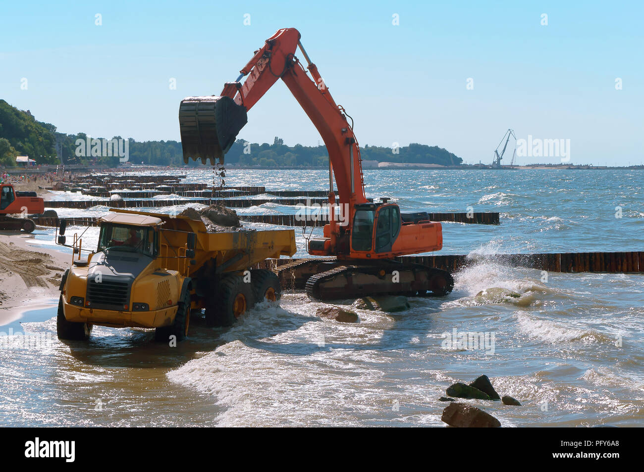 construction equipment on the shore, the construction of breakwaters ...