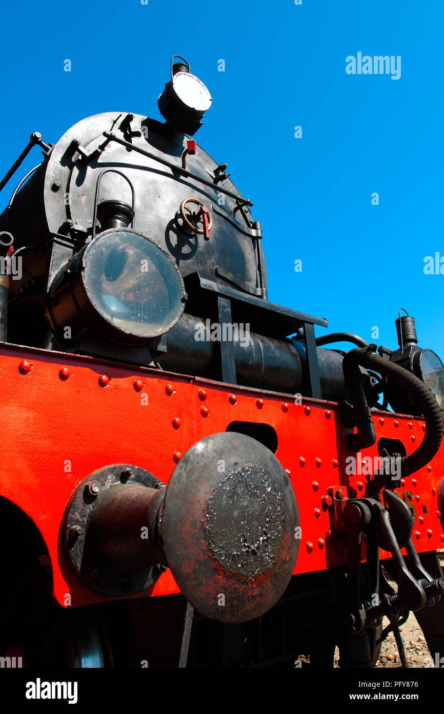 Detail of Vintage steam engine against blue sky Stock Photo - Alamy