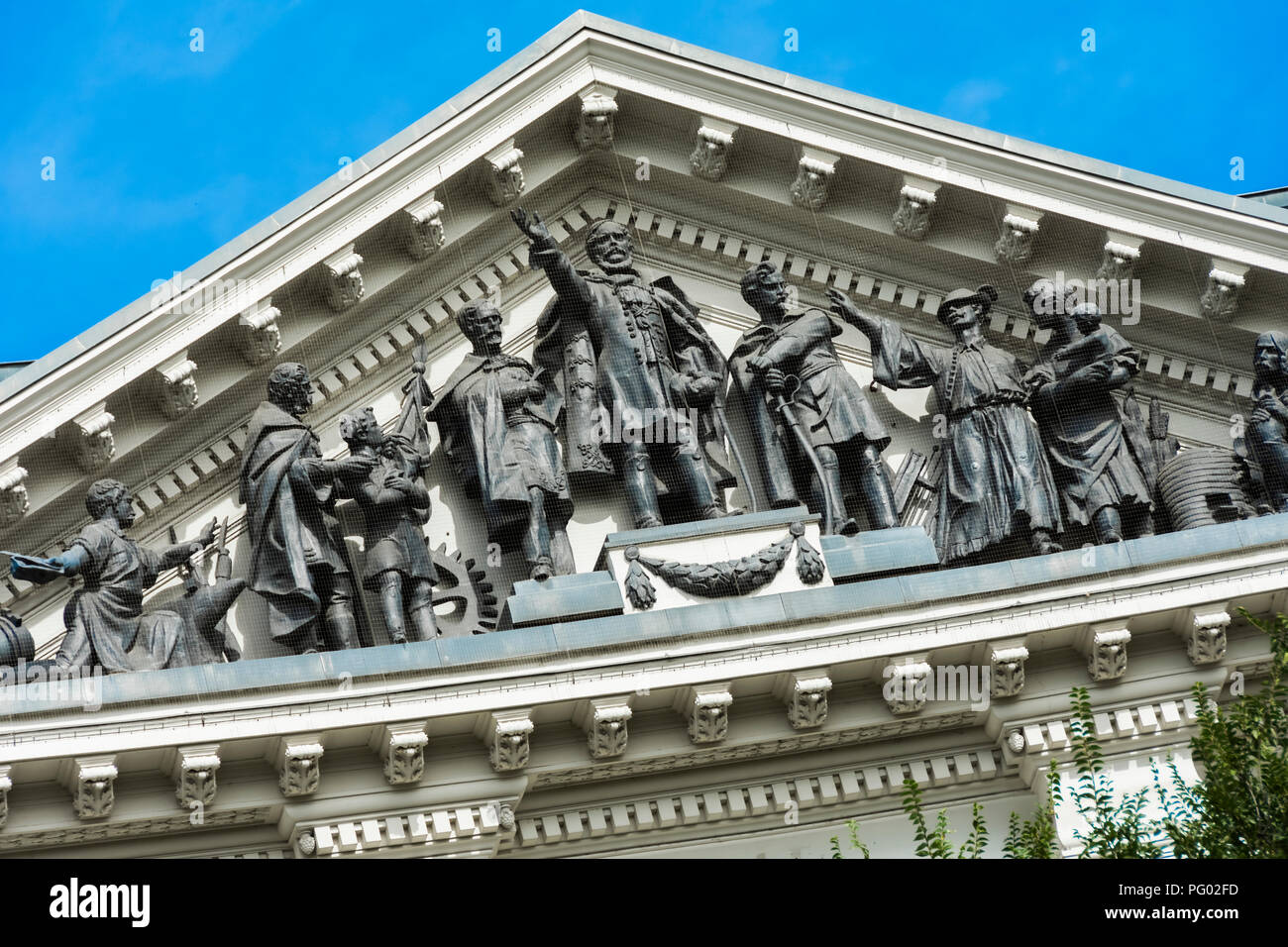 Bronze statues building facade Stock Photo - Alamy