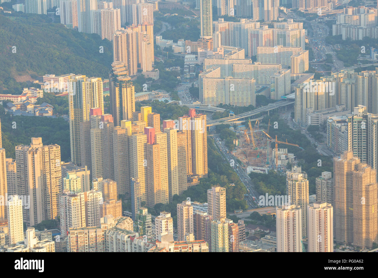 a city in asia with traffic and a river between skyscrapers Stock Photo ...