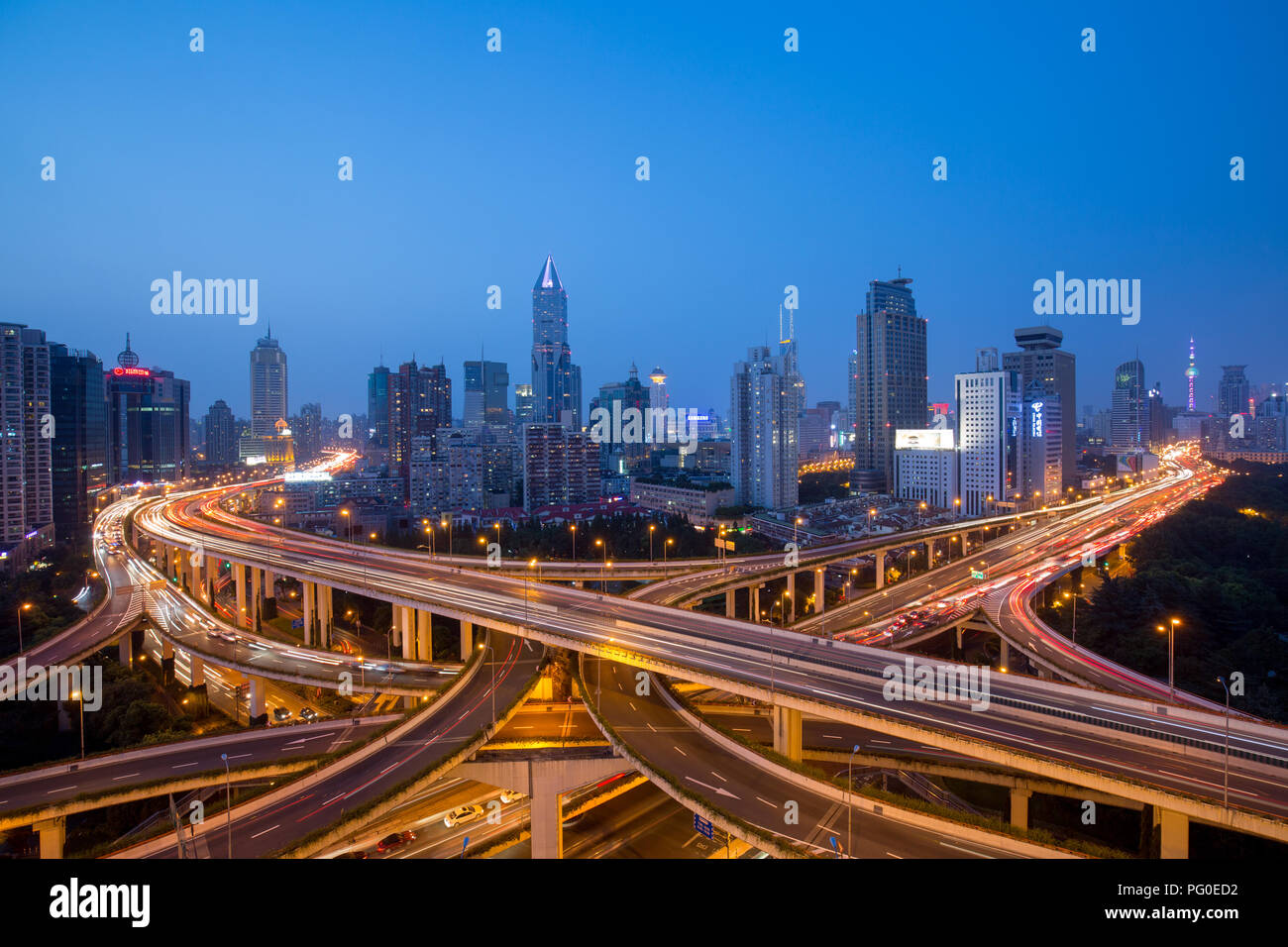 a big asia city by night to the sunrise with all the lights on the ...