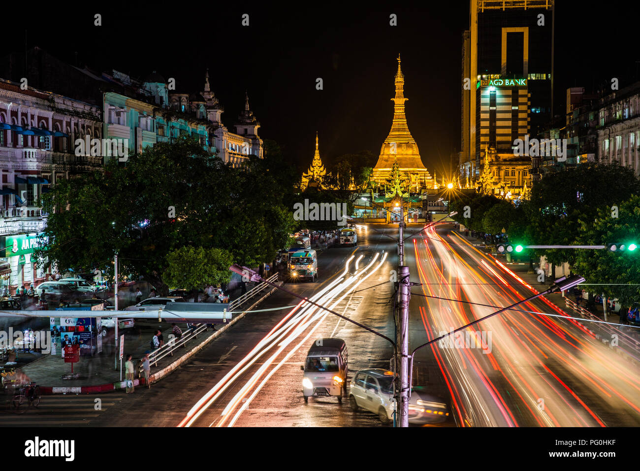 a big asia city by night to the sunrise with all the lights on the ...