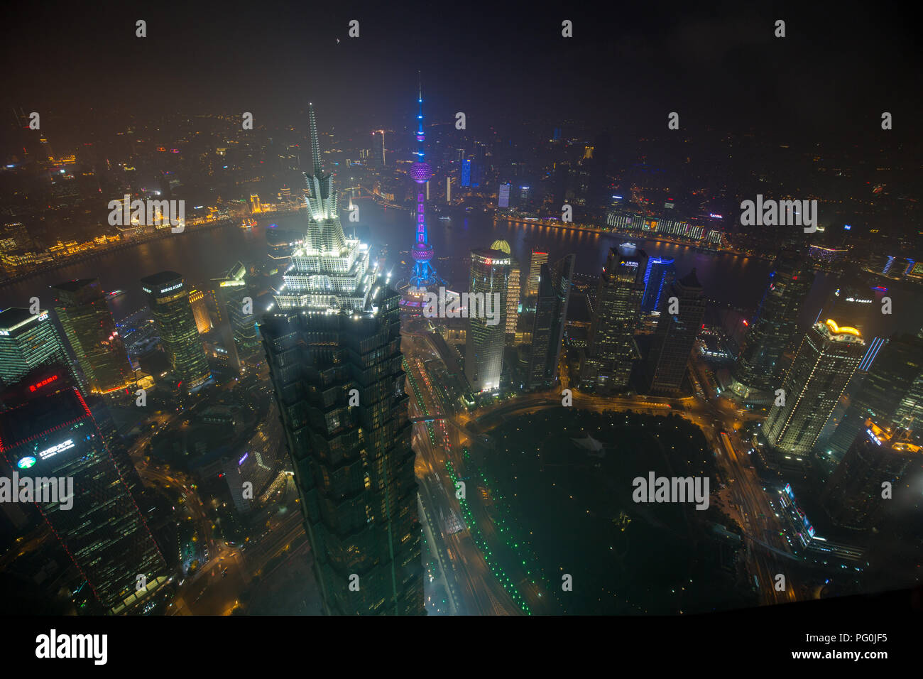 a big asia city by night to the sunrise with all the lights on the ...