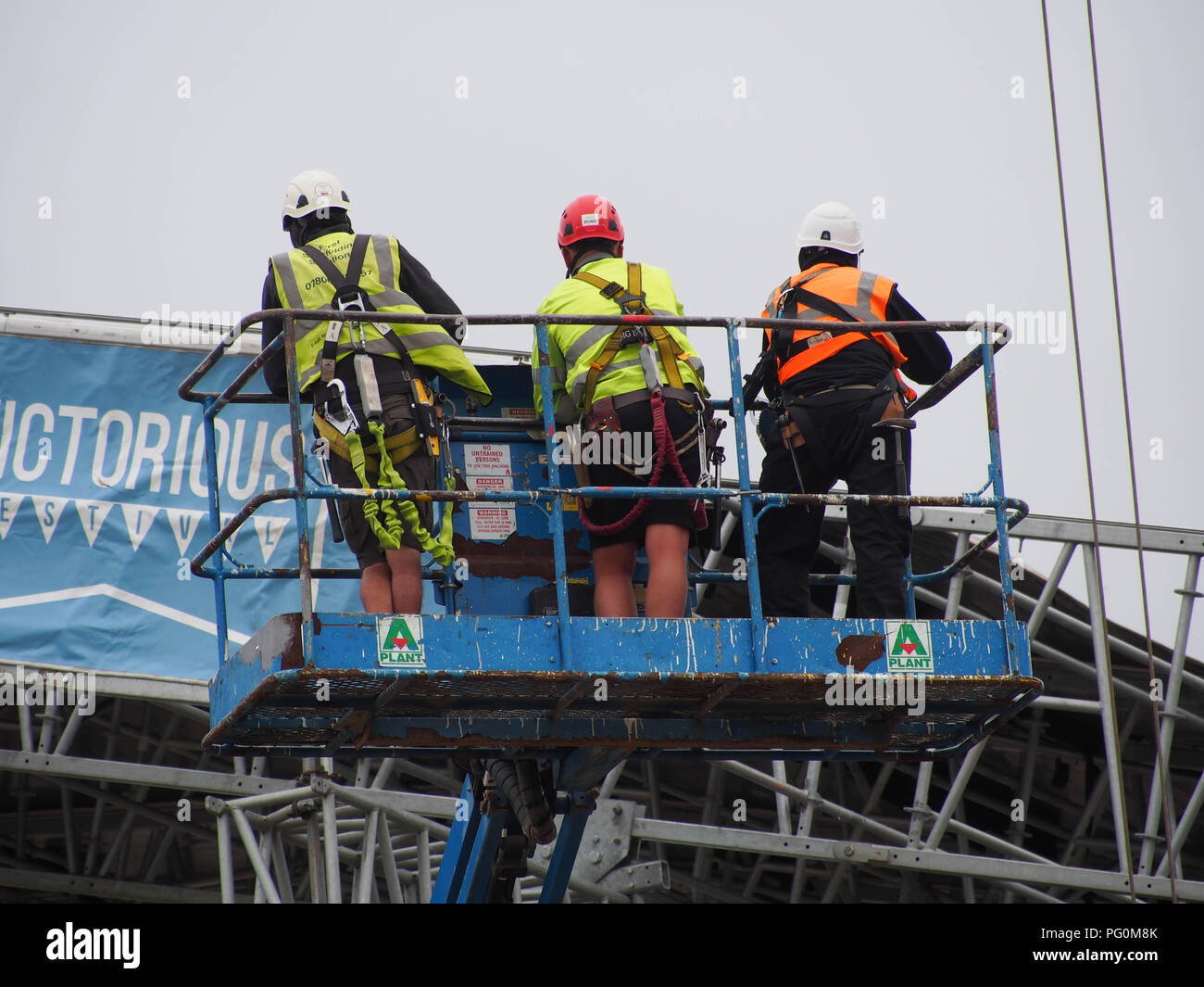 Construction workers in cherry picker hi-res stock photography and ...