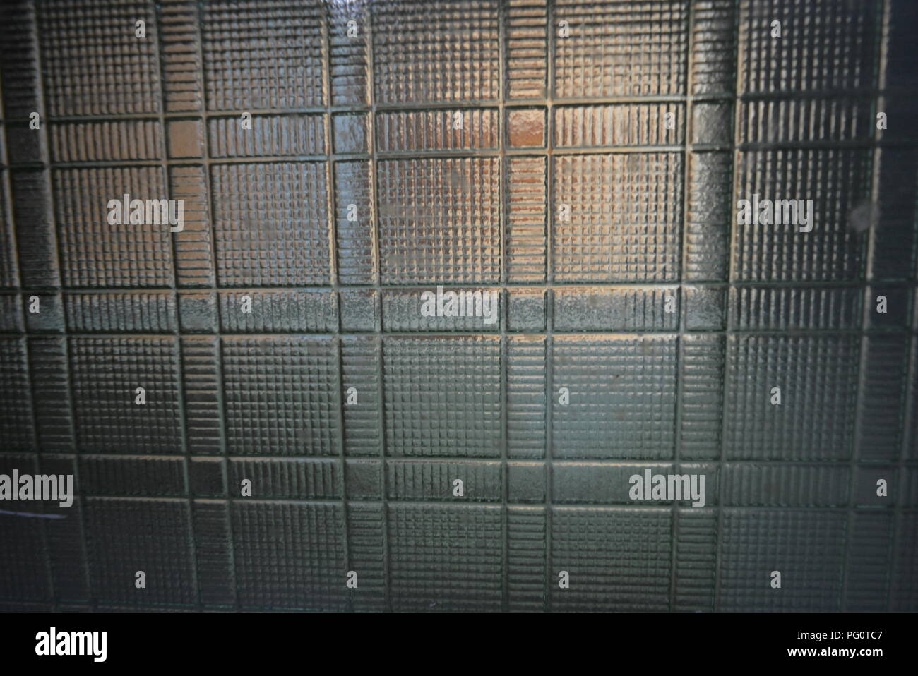 Glass dented background in the form of square wafers, squares and ...