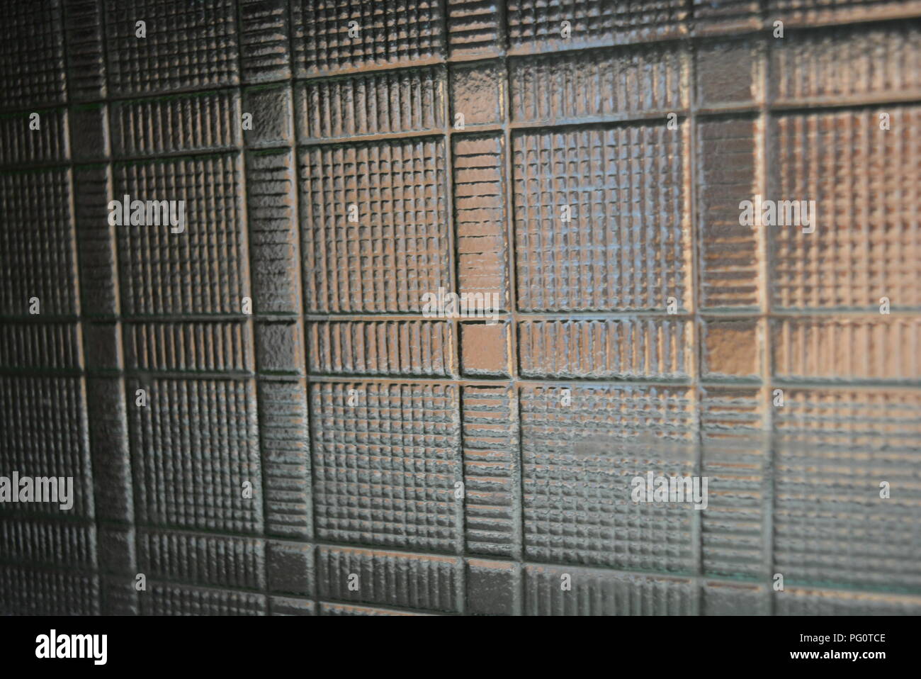 Glass dented background in the form of square wafers, squares and ...