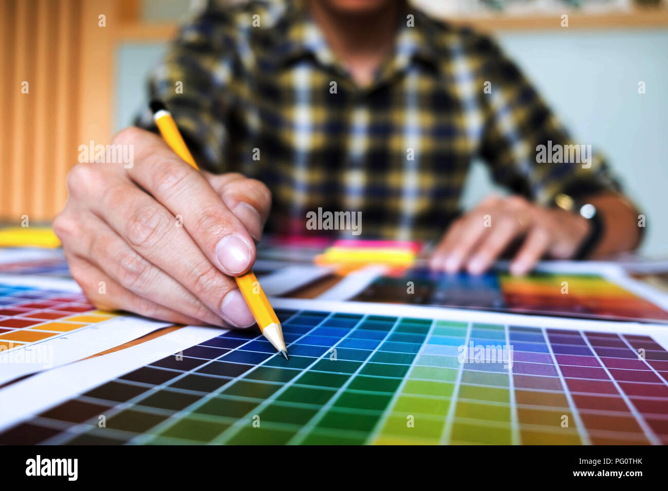 Graphic designers choose colors from the color bands samples for design ...