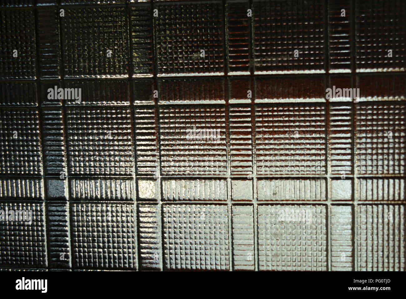 Glass dented background in the form of square wafers, squares and ...