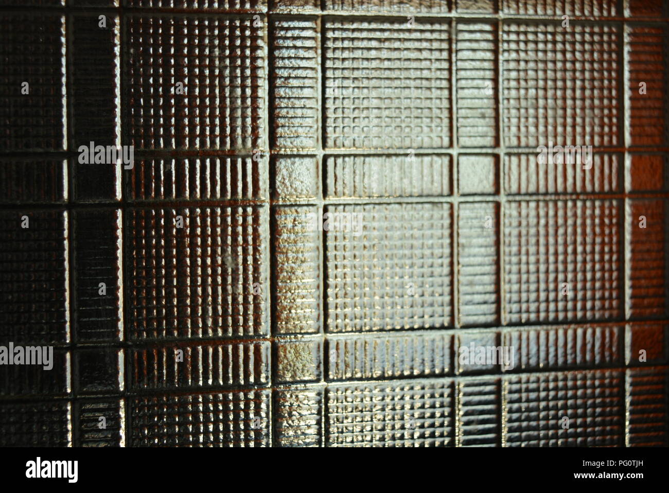 Glass dented background in the form of square wafers, squares and ...
