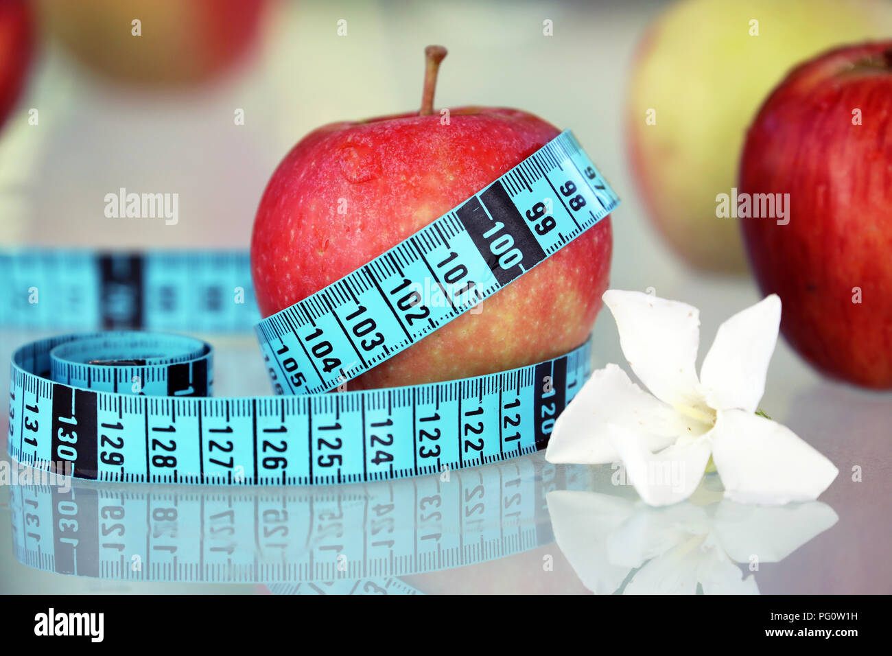 Fresh Red Apple With Measuring Tape With A White Flower. Close Up View ...