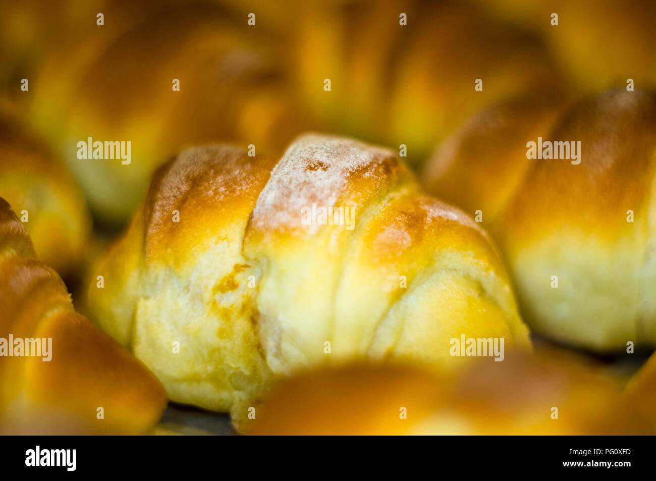 Fresh homemade croissants with sweet filling, before baking in the oven, selective focus Stock ...