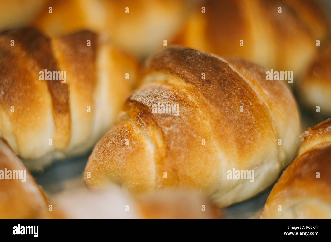 Fresh homemade croissants with sweet filling, before baking in the oven, selective focus Stock ...