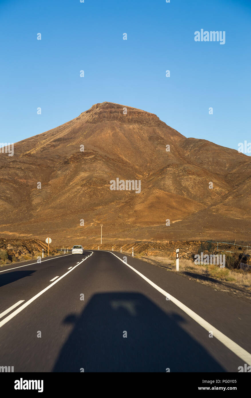 Car driving along mountain road in El Cotillo, Fuerteventura, Canary ...