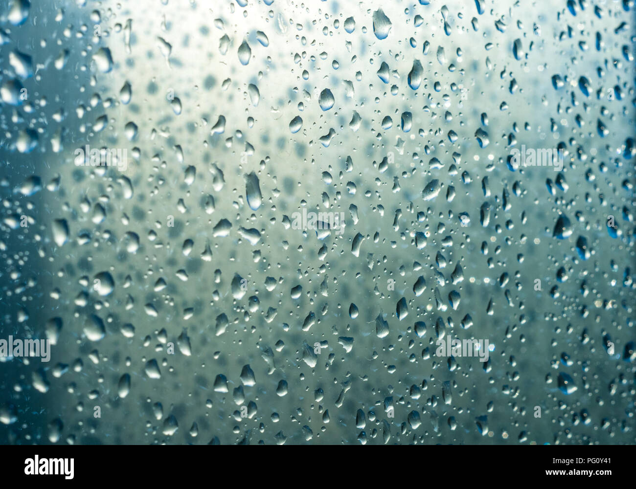 background of raindrops on window glass, toned, close-up Stock Photo ...
