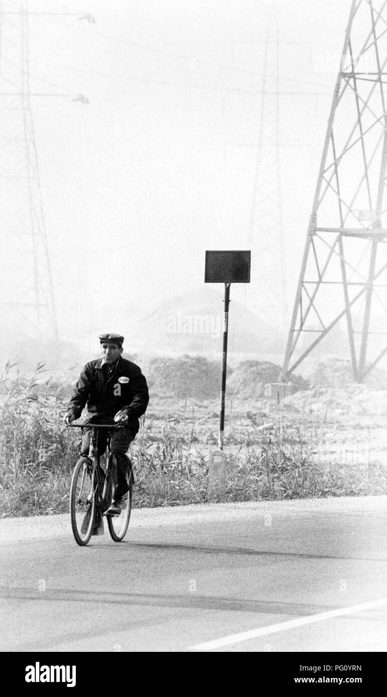 Italy, Lombardy, worker cycling Stock Photo - Alamy