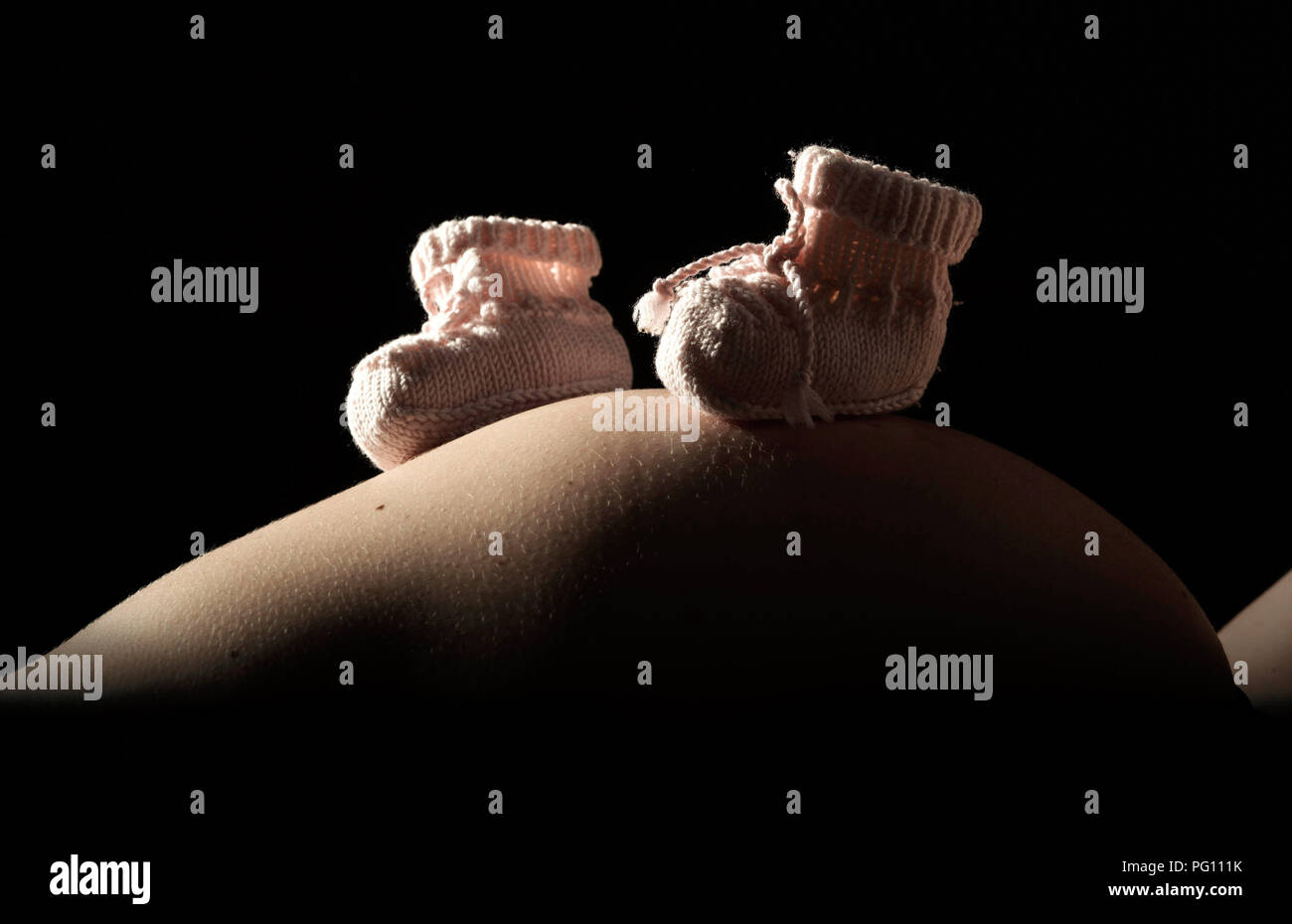 pregnant baby shoes Stock Photo - Alamy