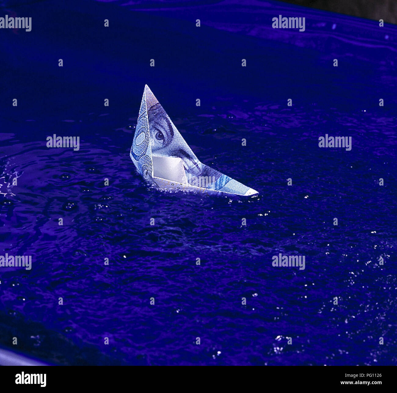 sinking money boat Stock Photo - Alamy