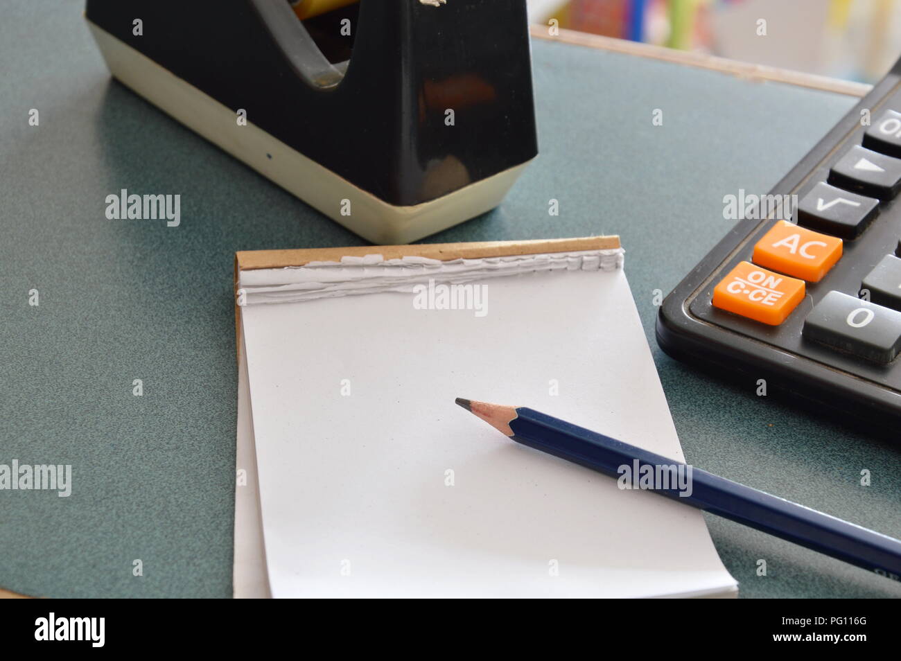 paper notebook and pencil on counter cashier in shop Stock Photo - Alamy