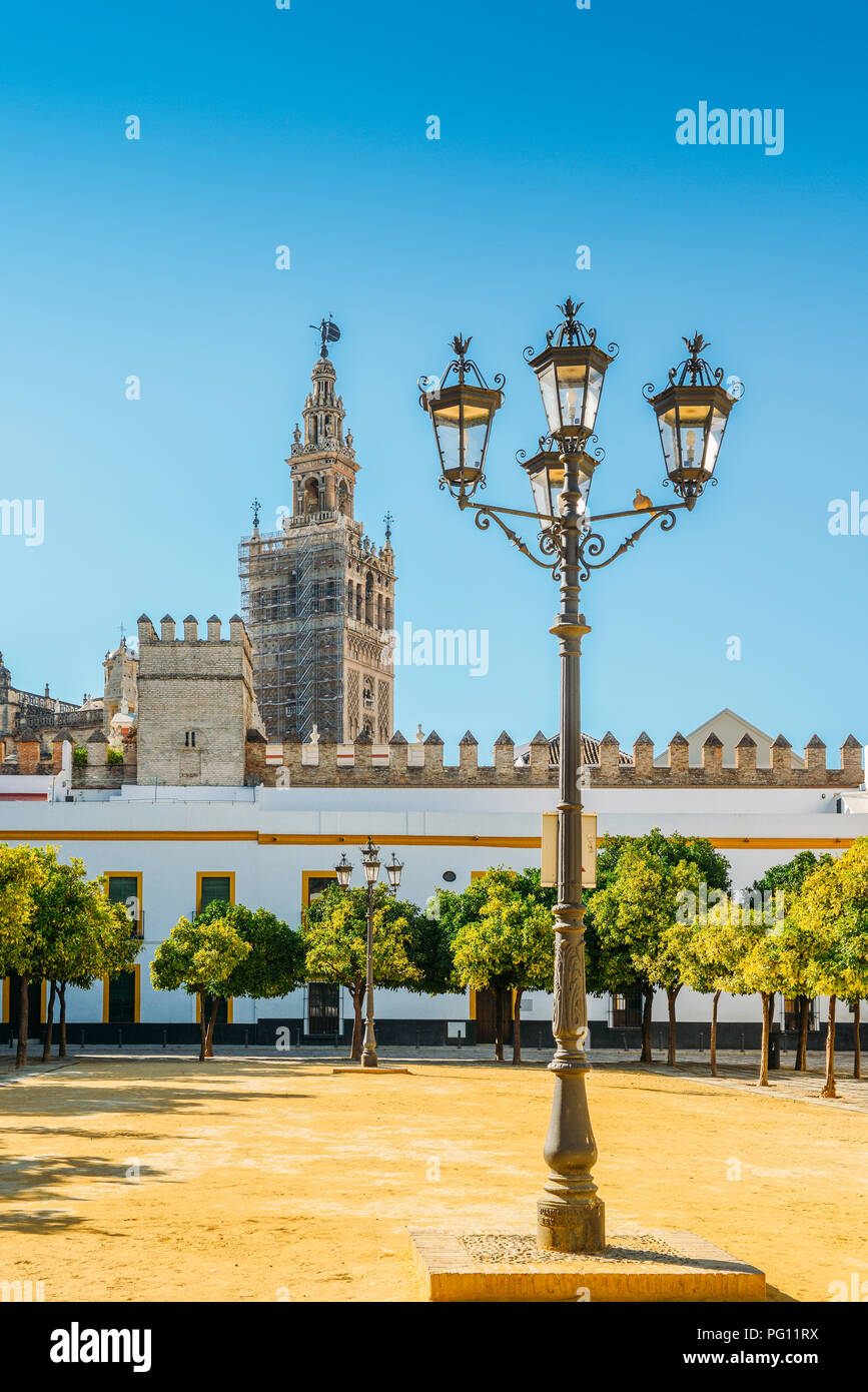 Juxtaposition of traditional lamp post with Gothic-Moorish bell tower ...