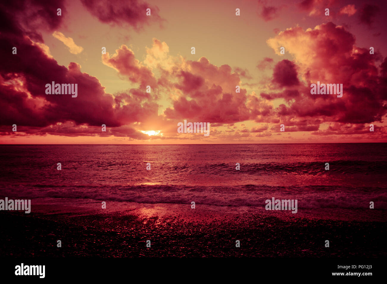 Colorful sunset over ocean Stock Photo - Alamy