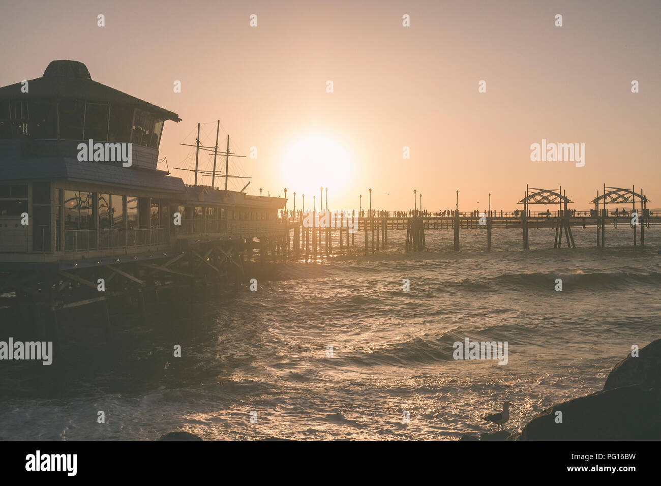 The sun sets with the ocean at Redondo Beach pier Stock Photo - Alamy