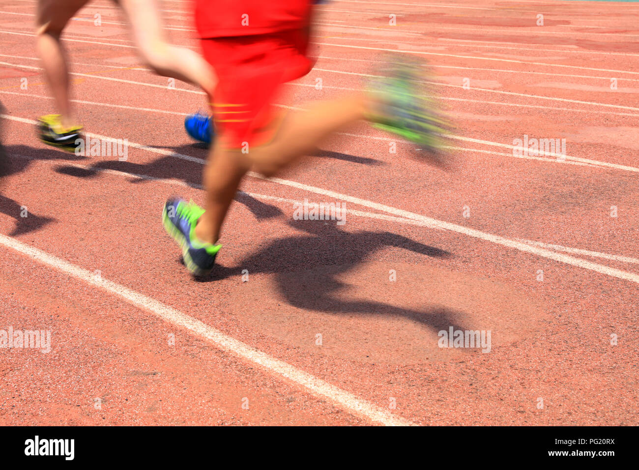 Athletes running in the playground of the runway, leg ministry close-up ...