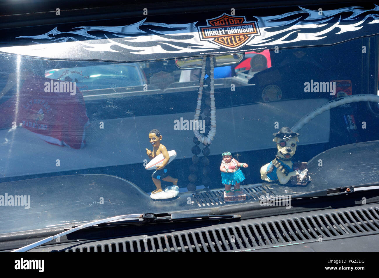 bobbleheads on a car's dash Stock Photo - Alamy