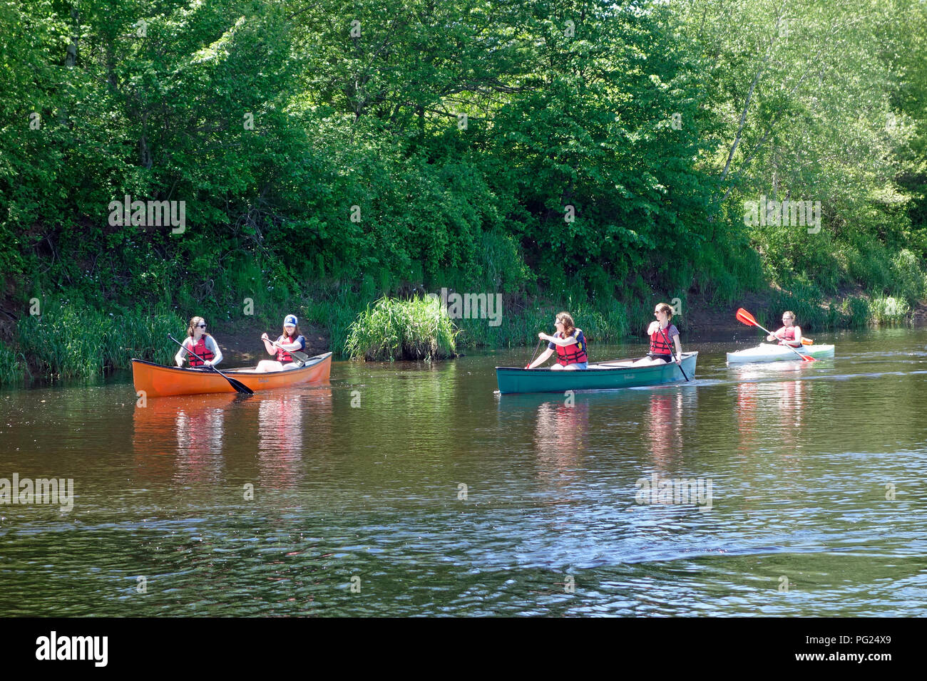 recreationalist canoers on a river Stock Photo - Alamy