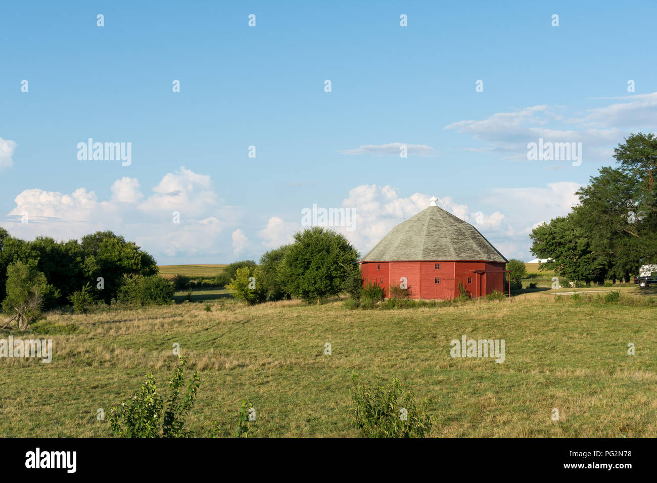 Unique round red barn surrounded by open farmland in rural illinois ...