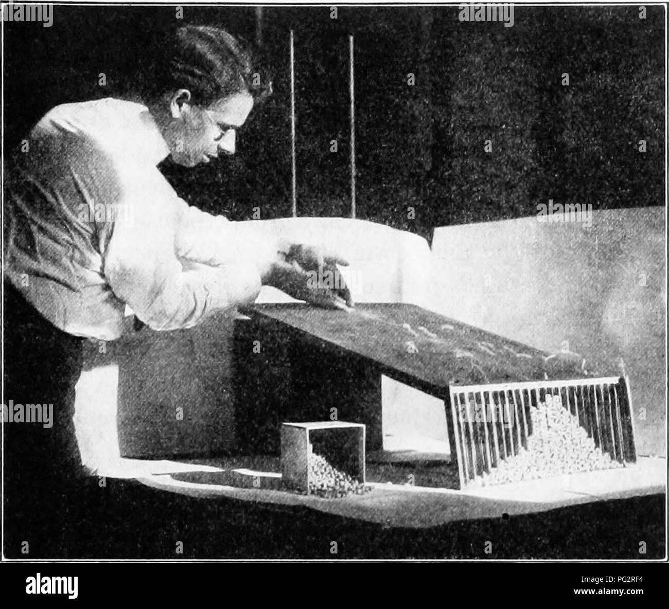 This photograph shows beans rolling down an inclined plane and ...