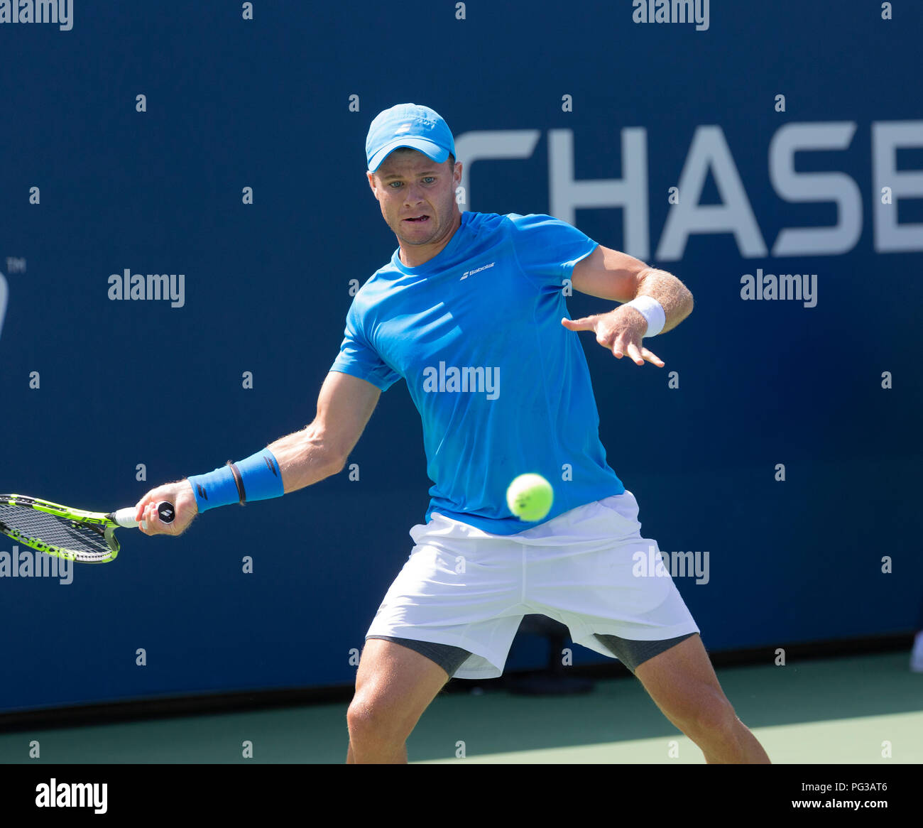 New York, NY - August 23, 2018: Christian Harrison of USA returns ball ...