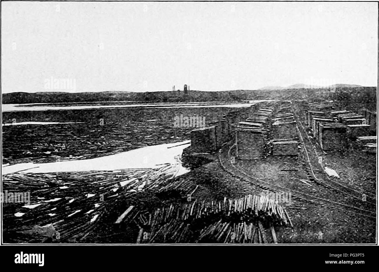 This illustration shows a log boom and lumber piles at Tupper Lake, New ...