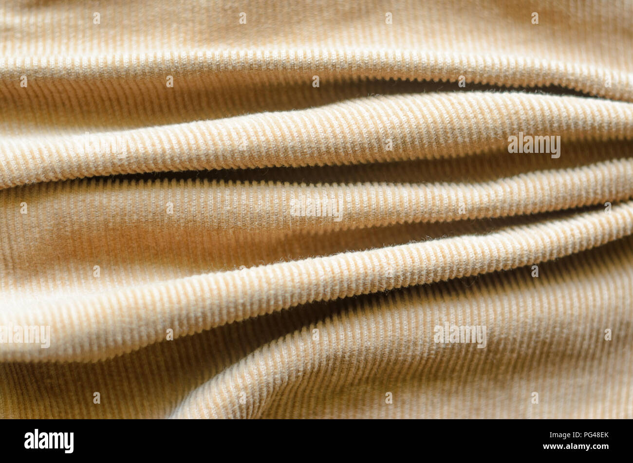 Texture of Soft Velvet Fabric with Folds Closeup. Texture of Beige ...