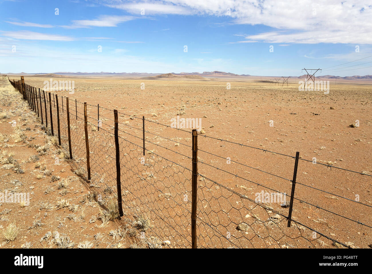 Iron fence and a gate of an rural african ranch in desert landscape ... Iron fence and a gate of an rural african ranch in desert landscape ...
